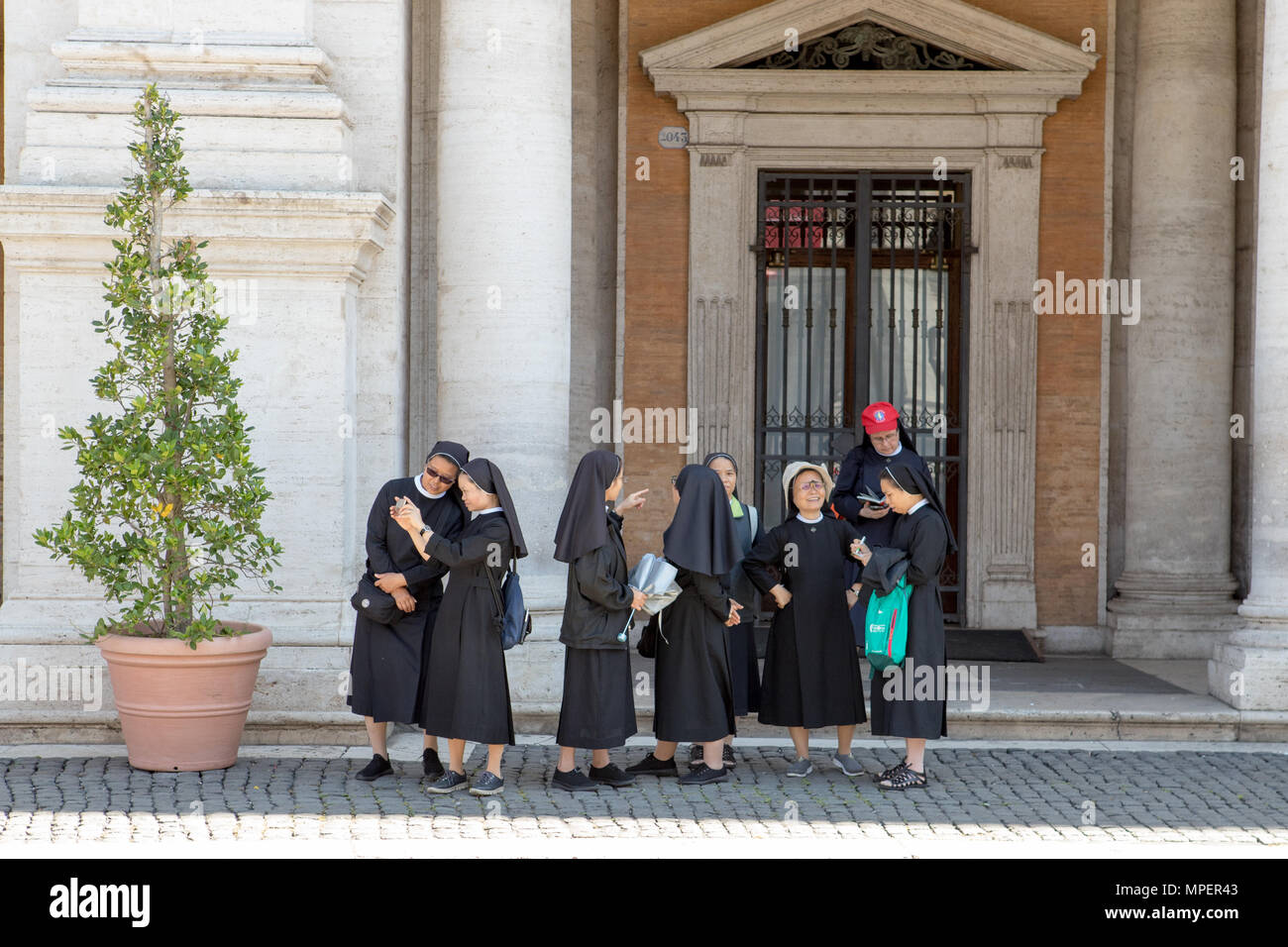 Rome Italy,group of nuns standing on street, scene Stock Photo - Alamy