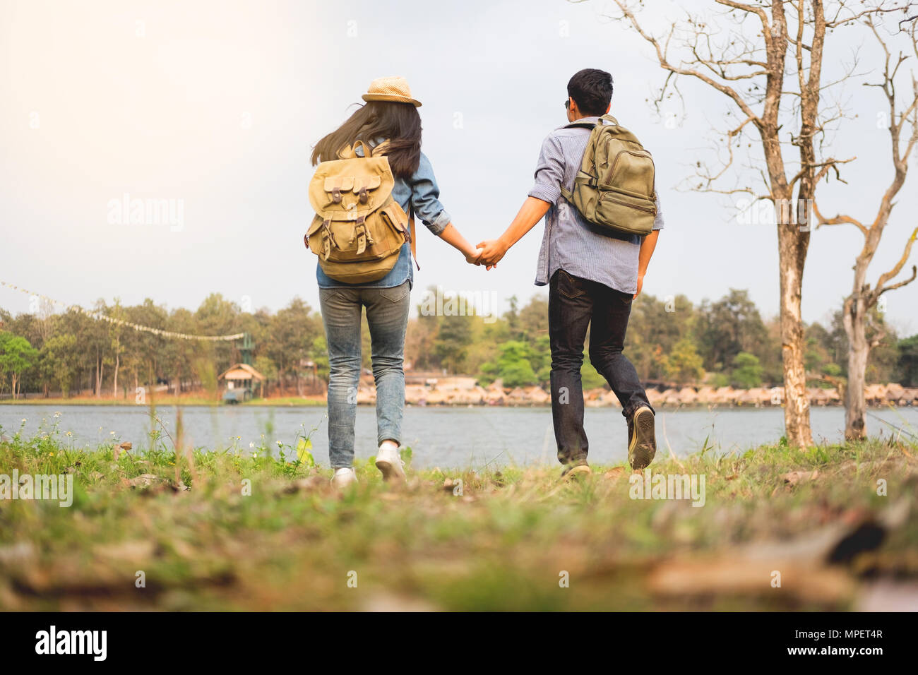 Outdoor shot of happy young loving couple hikers at valley of the ...