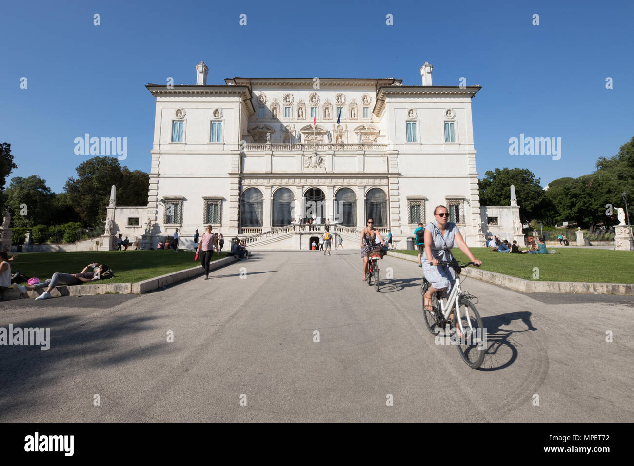 Rome Italy Villa Borghese, Museum Borghese palace tourists on bike ...