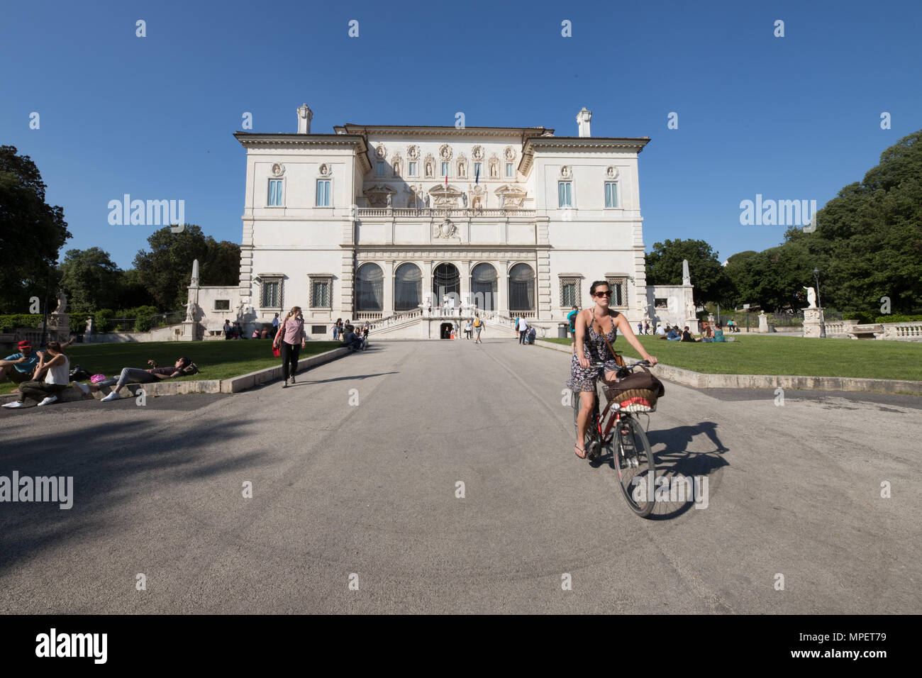 Rome Italy Villa Borghese, Museum Borghese palace tourists on bike ...