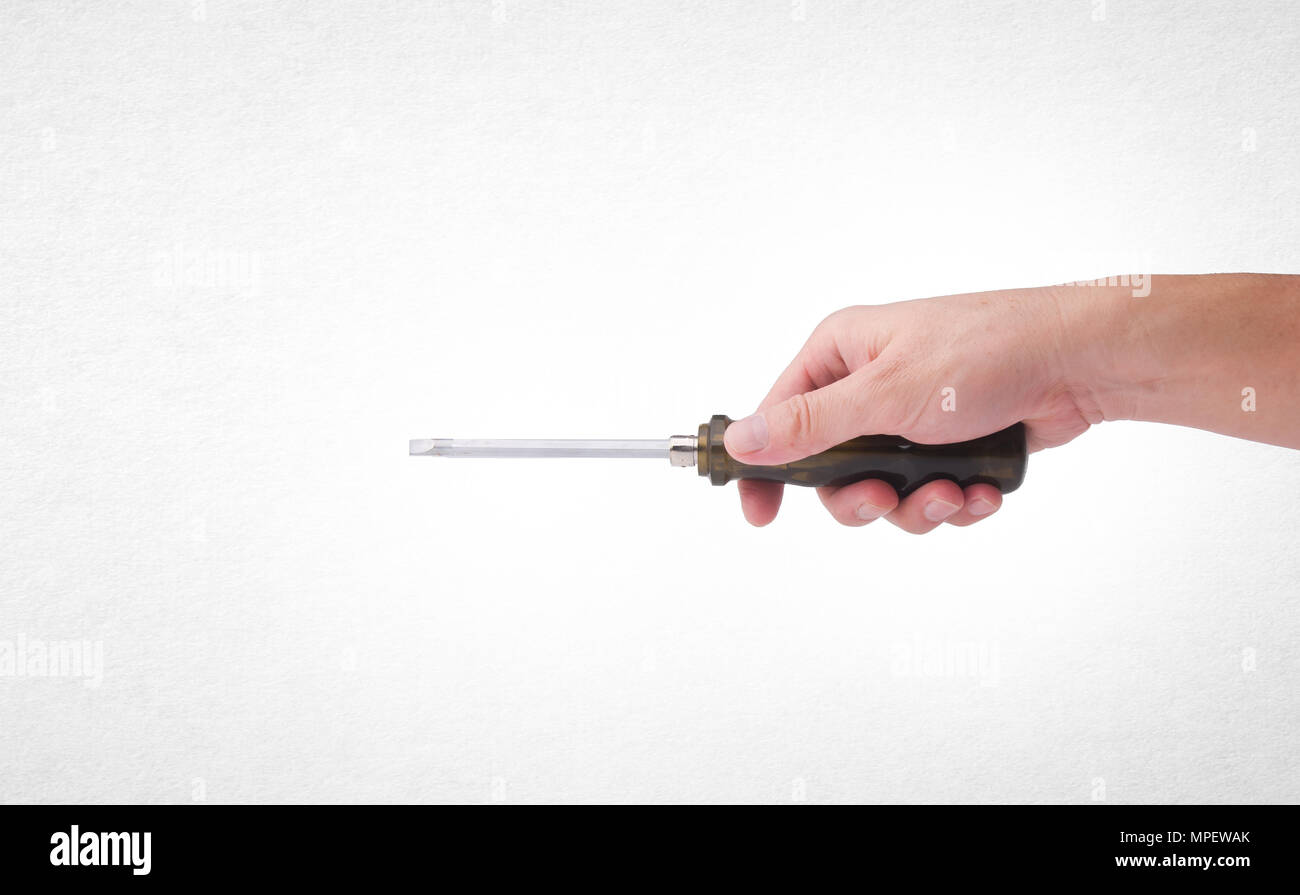 screwdriver or screwdriver in hand on a background Stock Photo - Alamy