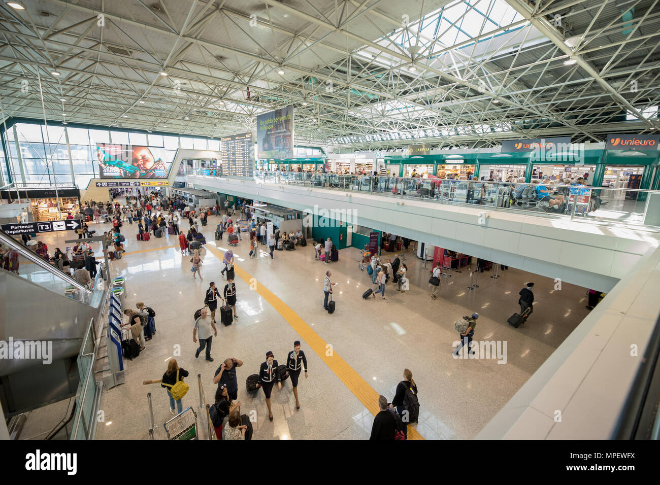 Rome Fiumicino airport, interior scene passengers walking, panoramic hi ...