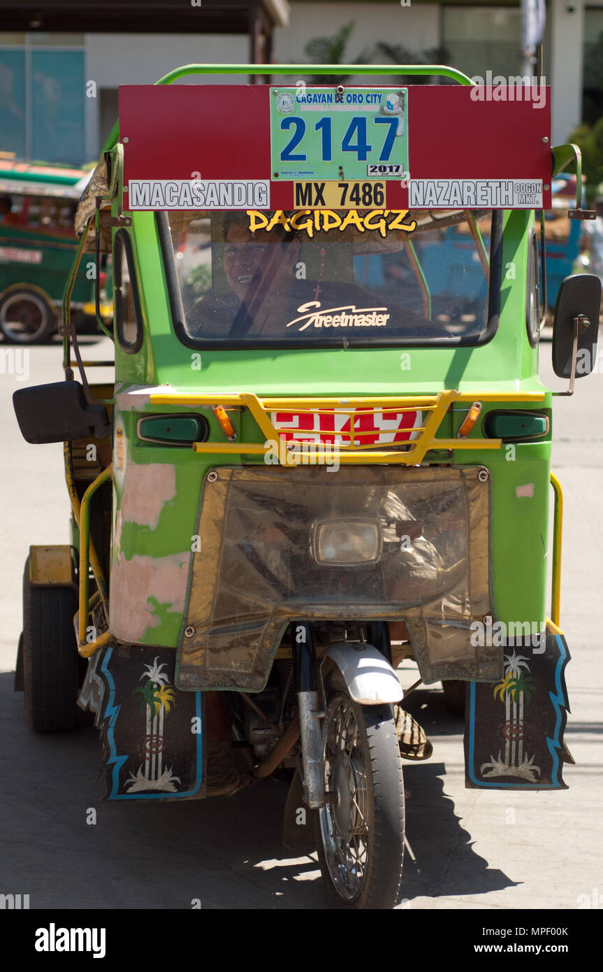 A green motor tricycle, Cagayan de Oro, Mindanao Stock Photo - Alamy