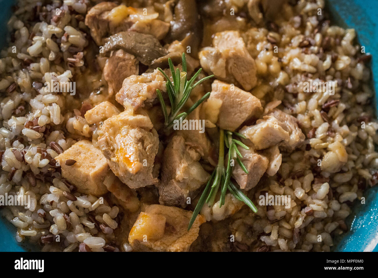 Pork Stew and Brown Rice Stock Photo - Alamy