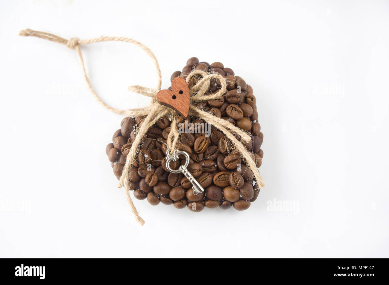 heart made of coffee beans. Valentine's Day. Handicraft Stock Photo - Alamy