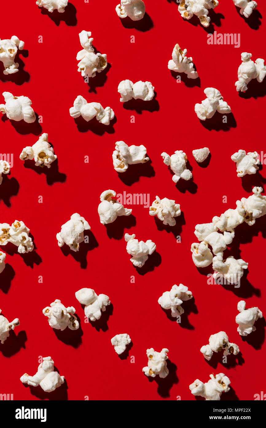 Popcorn on red background, pop contemporary style Stock Photo - Alamy