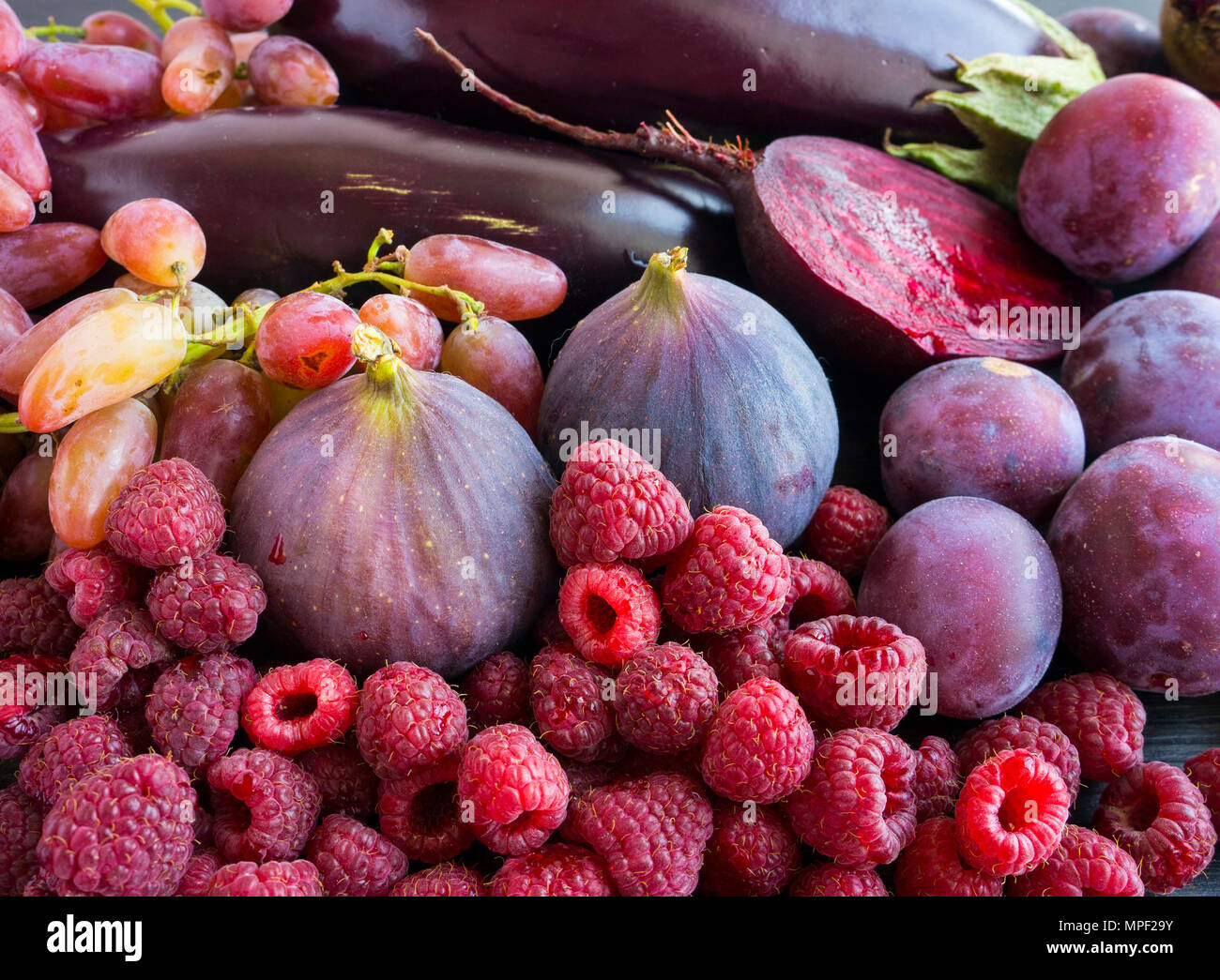 Purple food. Background of berries, fruits and vegetables. Fresh figs ...