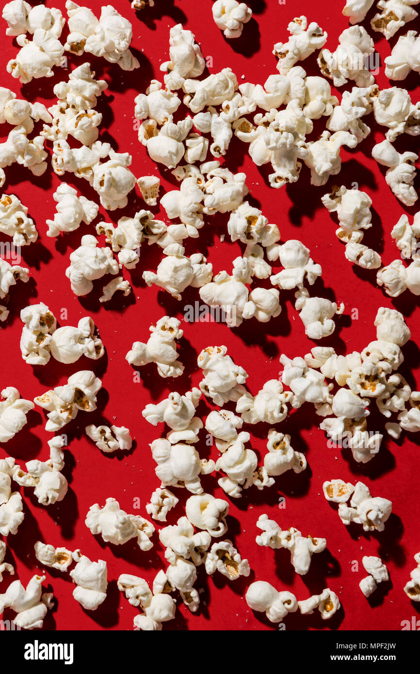 Popcorn on red background, pop contemporary style Stock Photo - Alamy