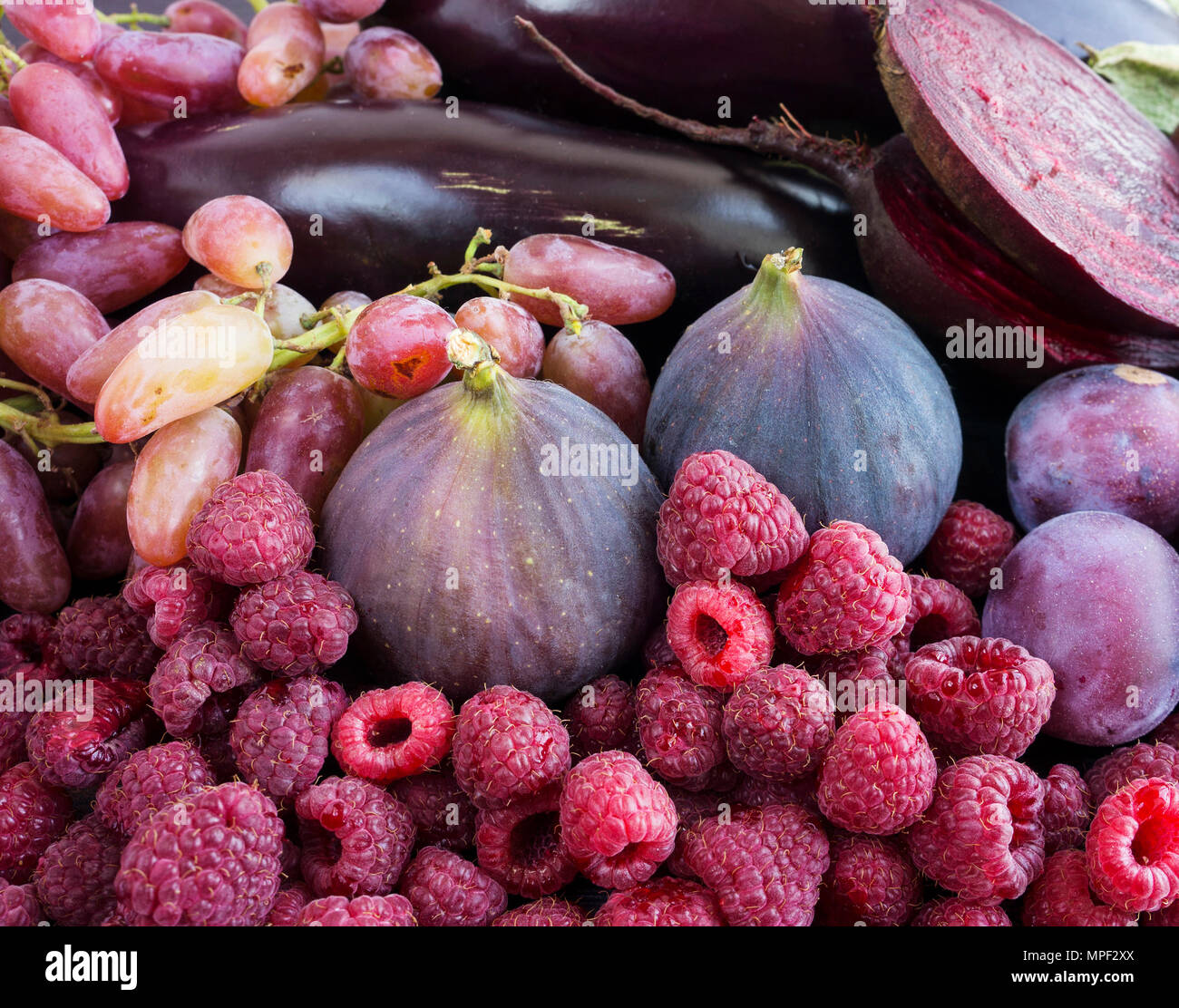 Purple food. Background of berries, fruits and vegetables. Fresh figs ...