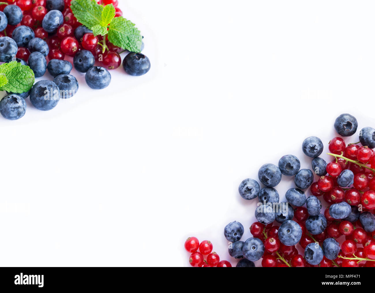 Ripe blueberries and red currants on a white background. Berries at ...