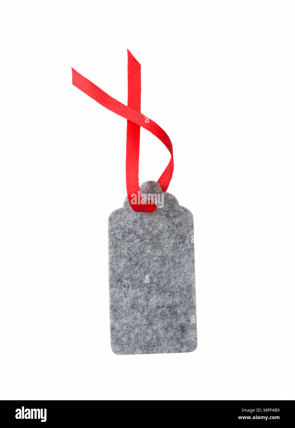 Christmas gift tag tied with red ribbon. Label from gray felt isolated ...