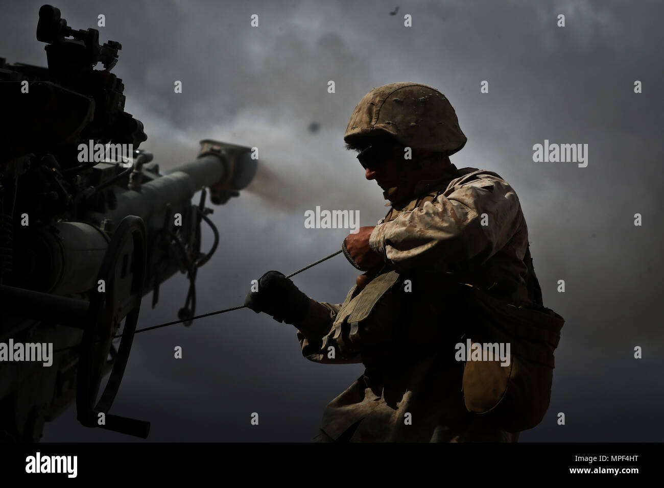 Cpl. Axl T. Chiasson, a field artillery cannoneer with Bravo Battery ...