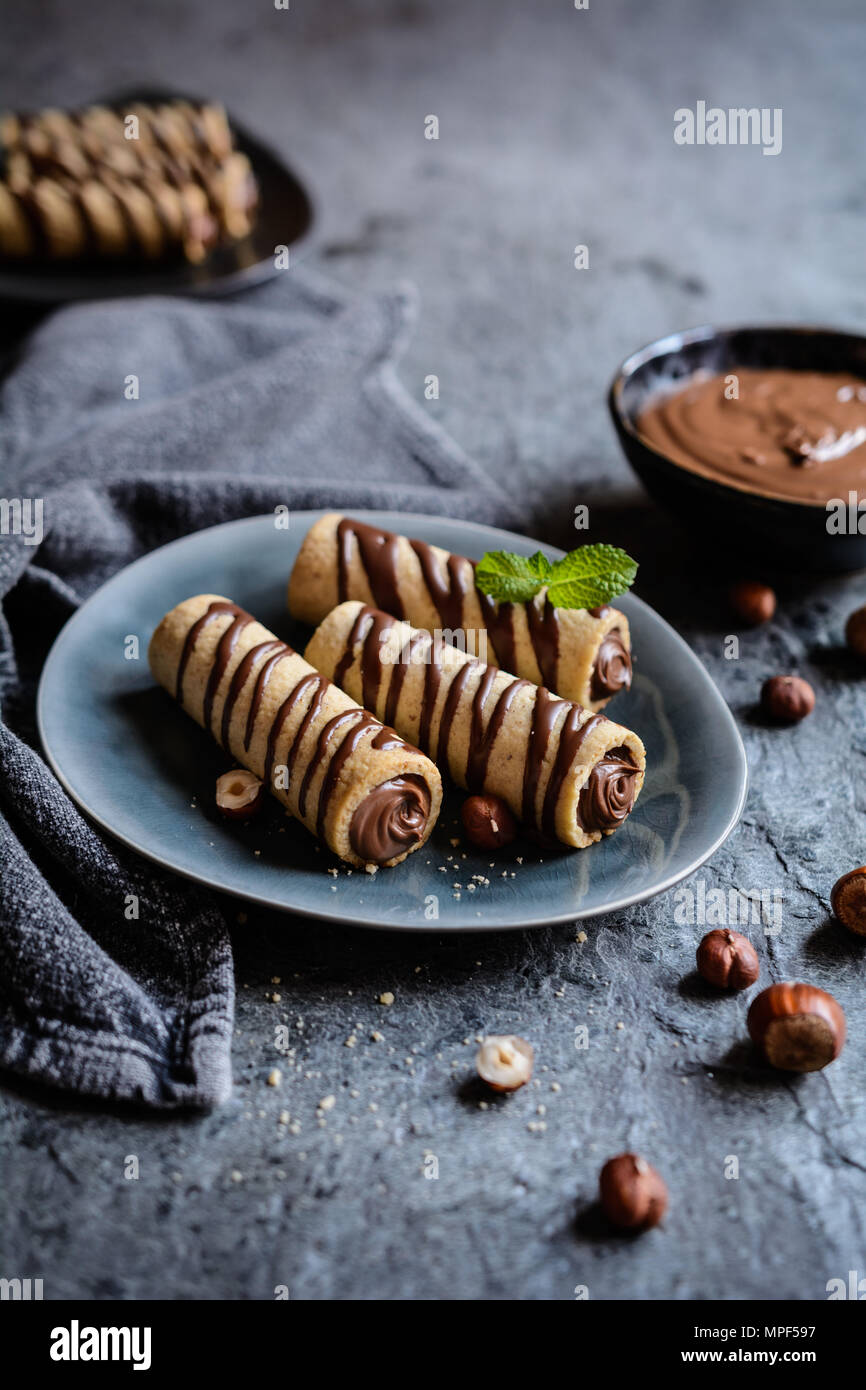 Delicious biscuit tubes filled with hazelnut cream and chocolate ...