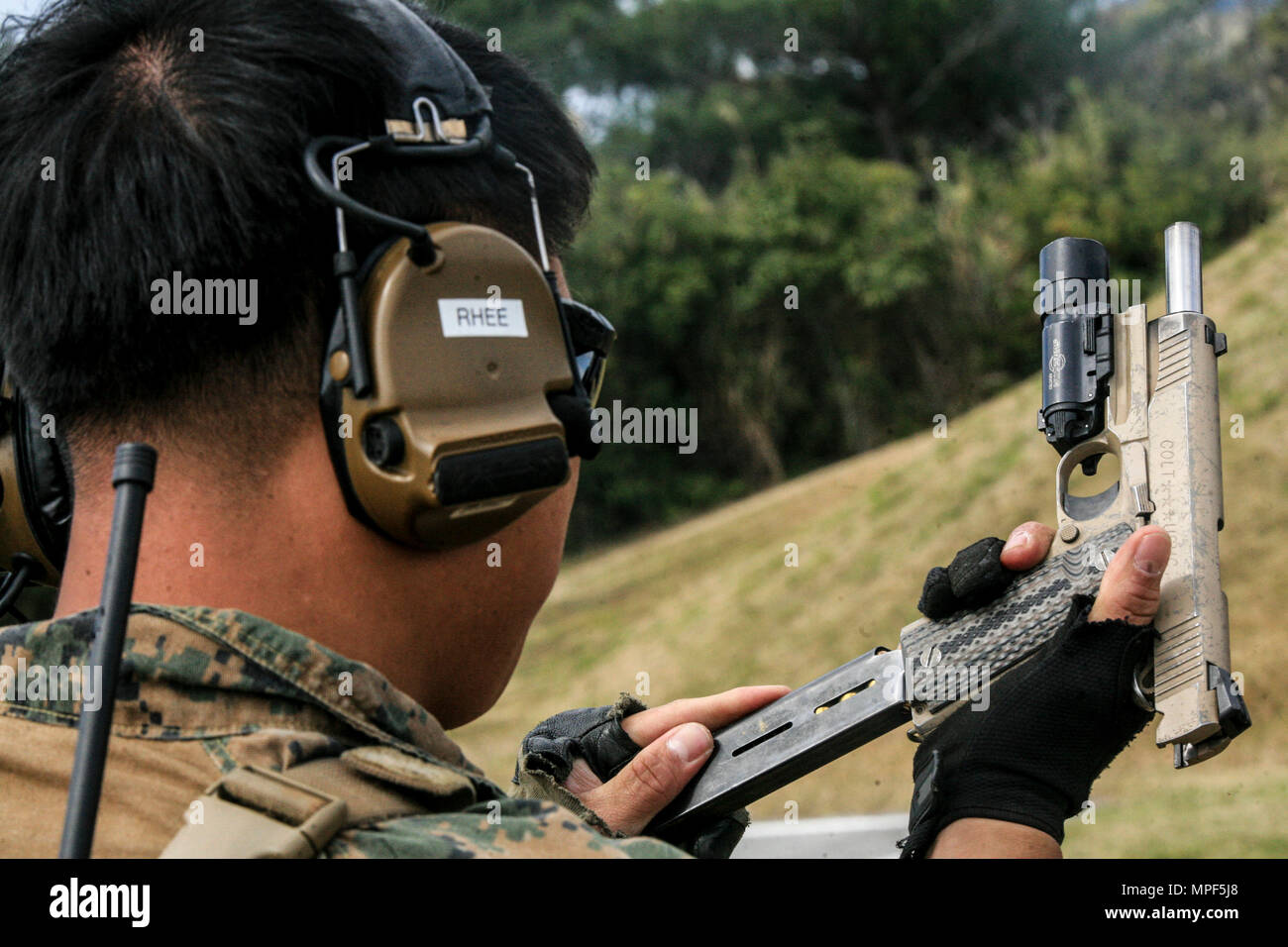 U.S. Marine Corps Sgt. Allen Rhee, a radio operator with Force ...