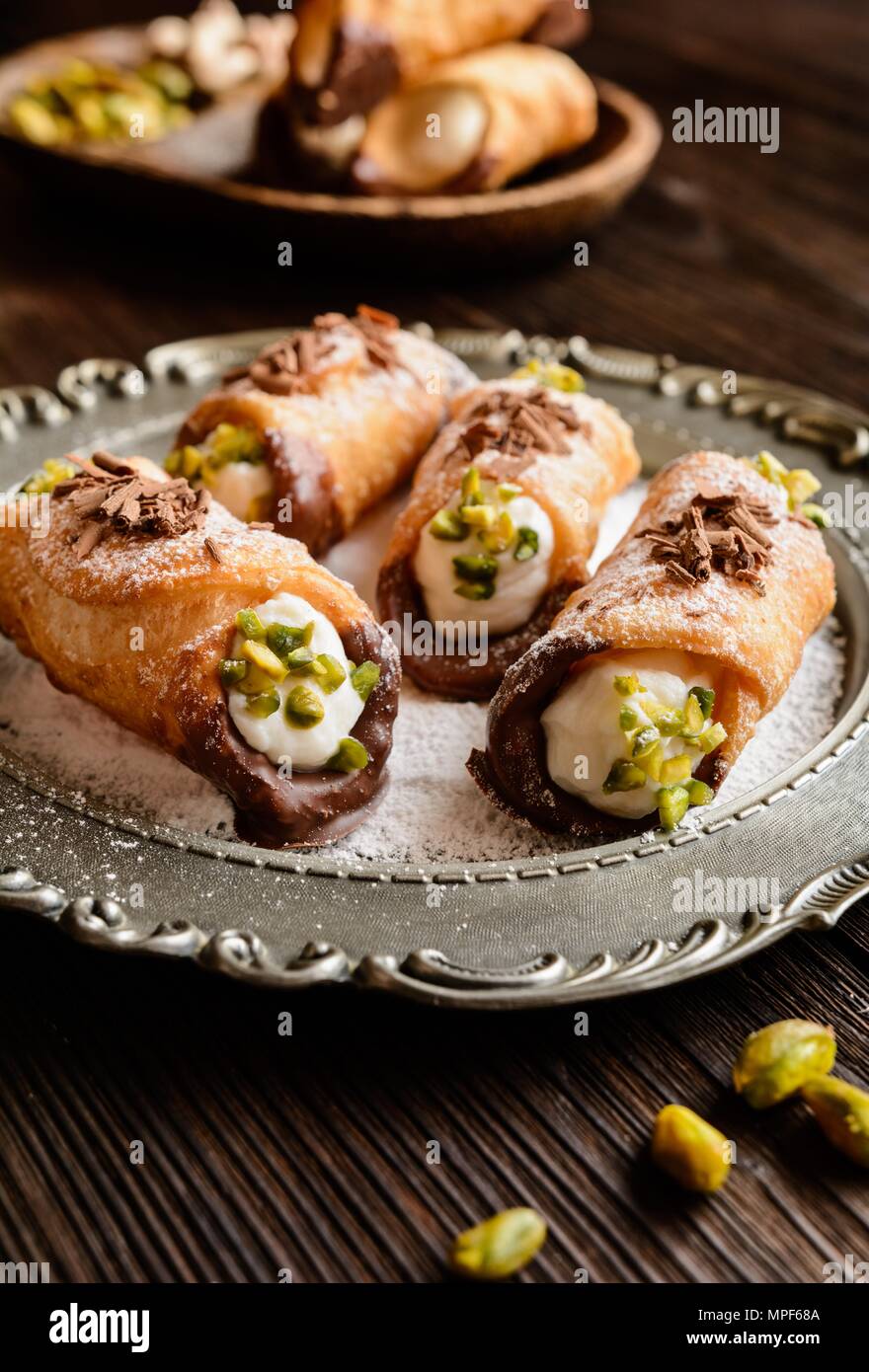 Cannoli Siciliani - traditional dessert stuffed with ricotta cream and ...