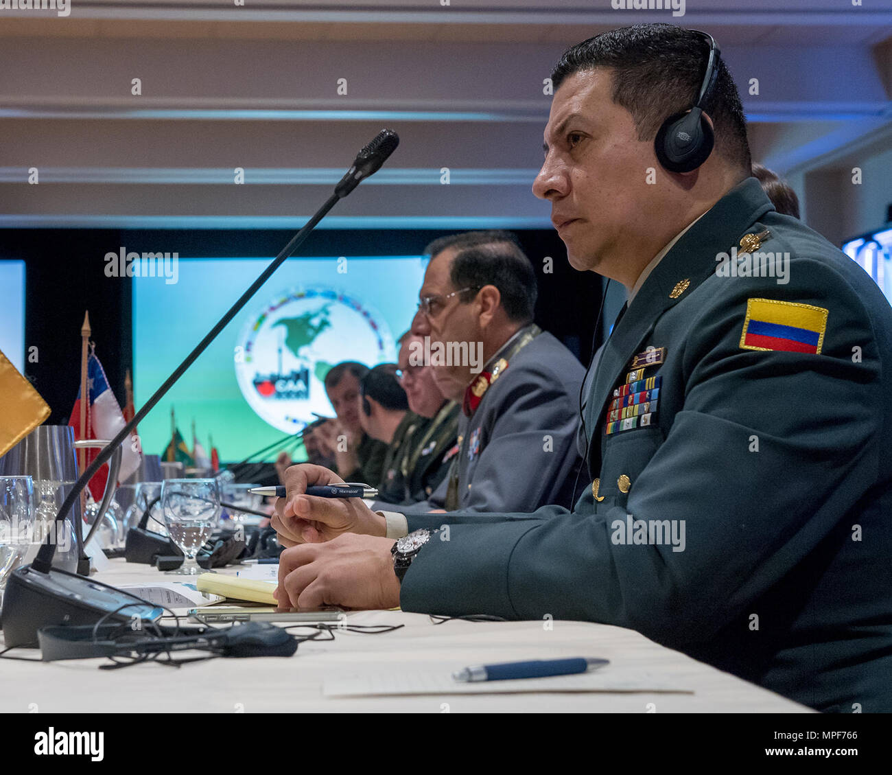Lt. Col. Giladarado Rayo Rincon, Colombian army delegate, listens ...
