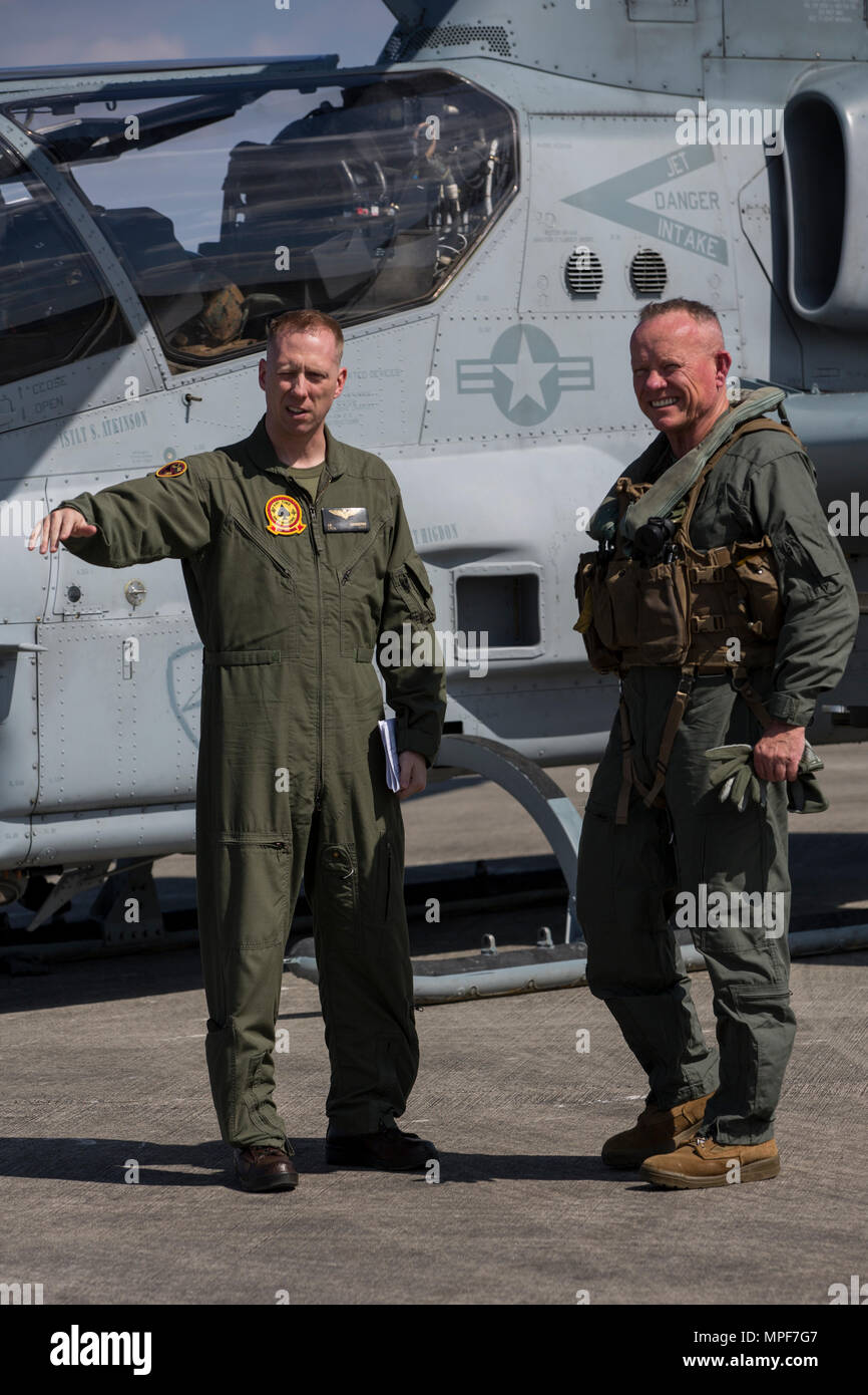 U.S. Marine Corps Lt. Gen. Lawrence Nicholson, right, talks to Lt. Col ...