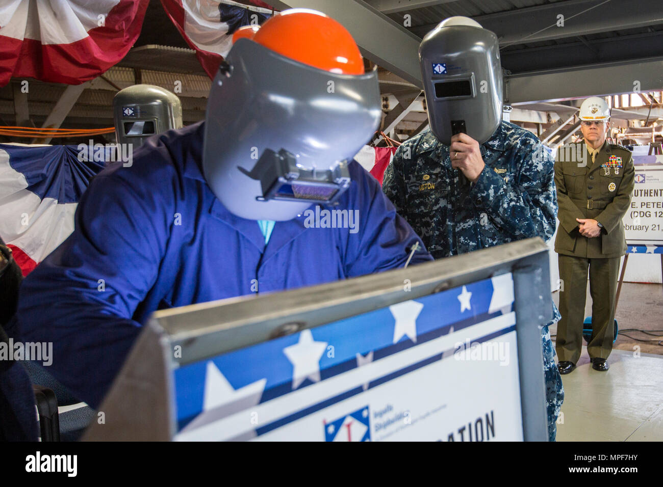 Jeremy Lally, structural welder for Ingalls Shipbuilding, welds the ...