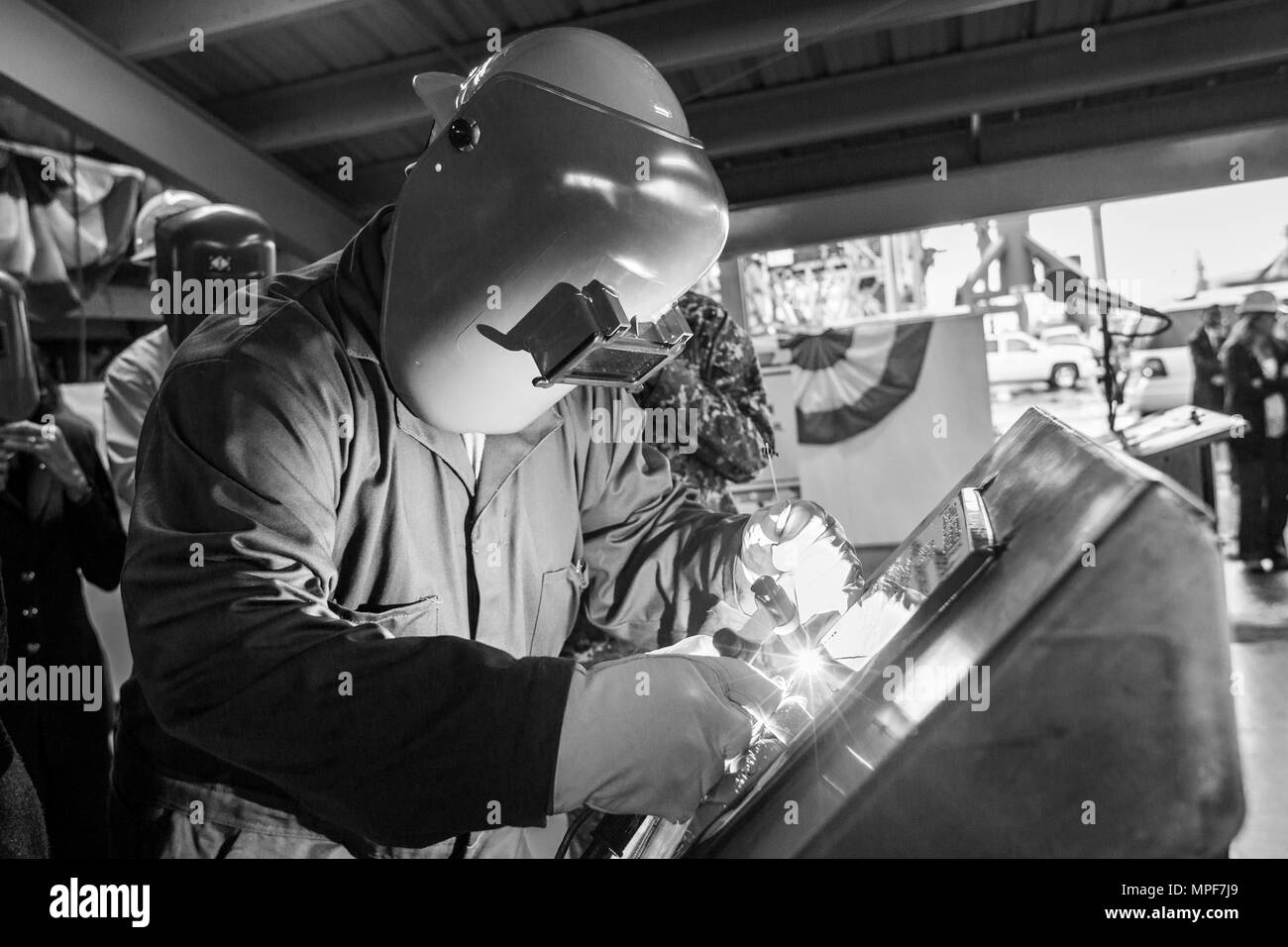 Jeremy Lally, structural welder for Ingalls Shipbuilding, welds the ...
