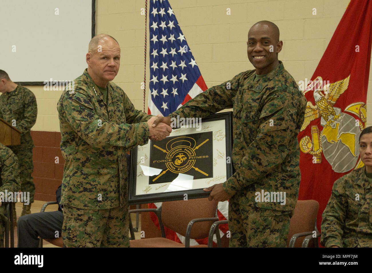 Commandant of the Marine Corps Gen. Robert B. Neller, left, is ...