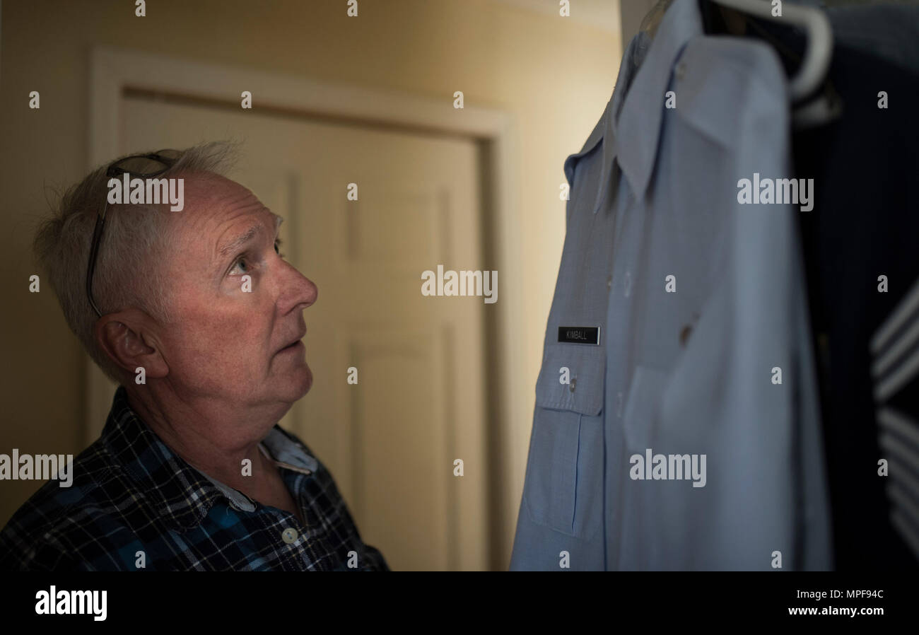 Chief Master Sgt. Tom Kimball looks over his dress uniform at his home ...