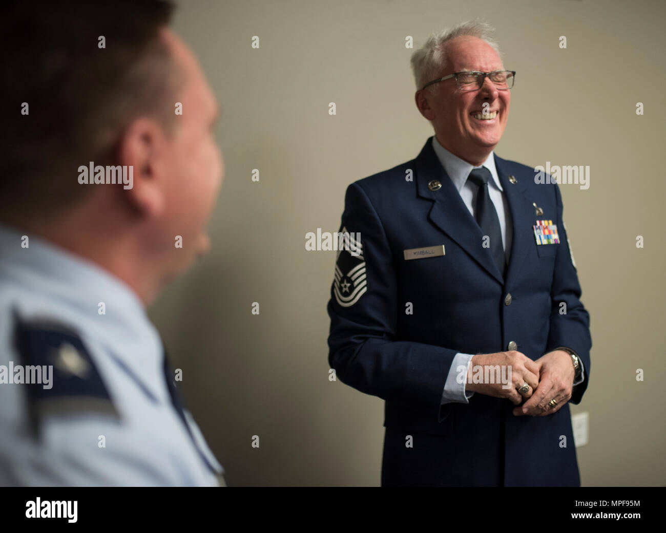 Chief Master Sergeant Tom Kimball shares a light moment with a ...