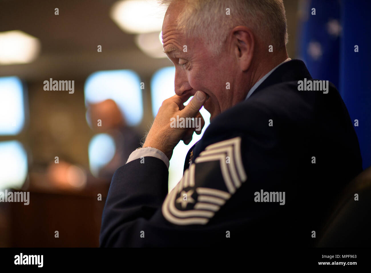Chief Master Sgt. Tom Kimball reacts to a joke made by Brig. Gen ...