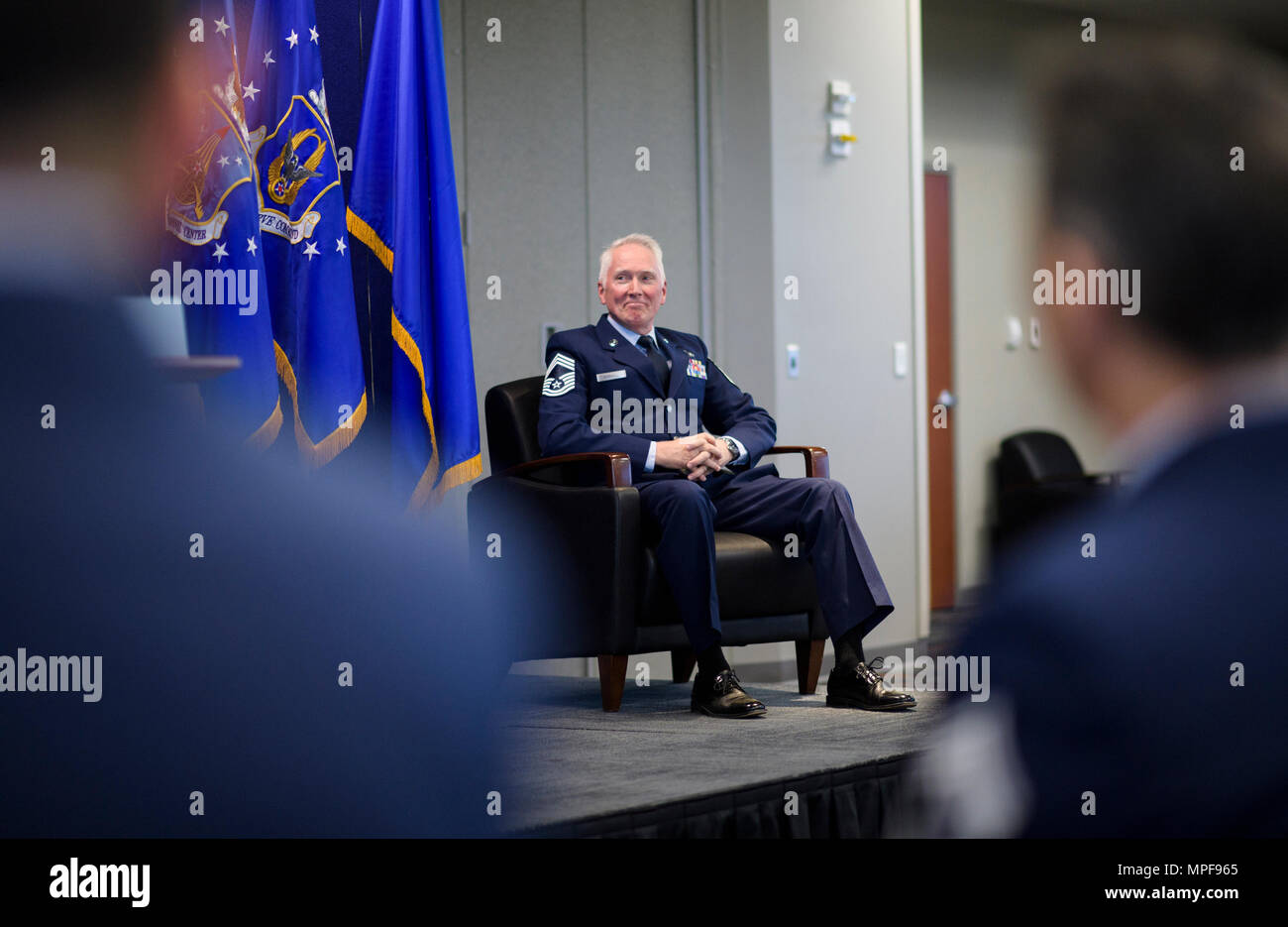 Chief Master Sgt. Tom Kimball reacts to a joke made by Brig. Gen ...