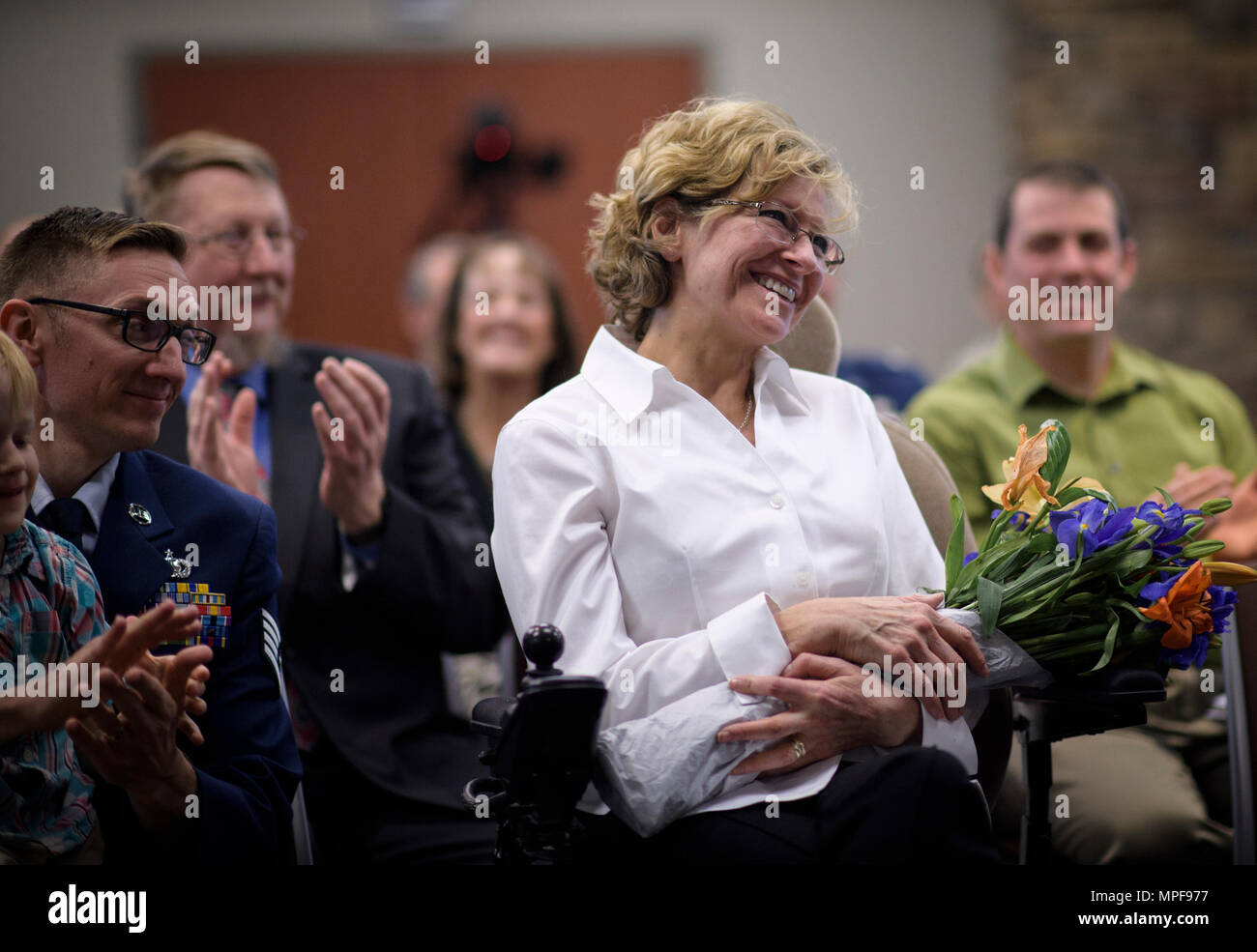 Tracey Kimball, wife of Chief Master Sgt. Tom Kimball, smiles in ...