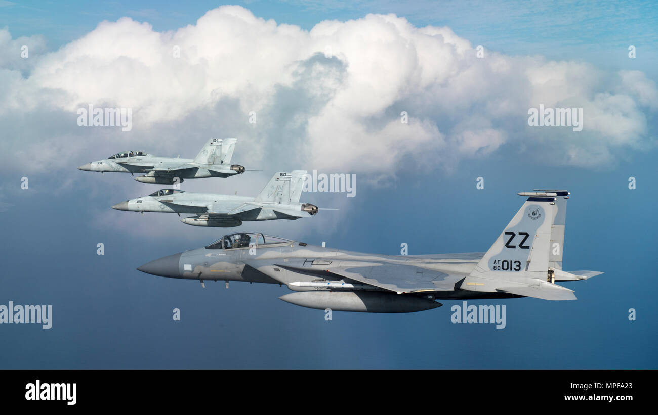 A U.S. Air Force 44th Fighter Squadron F-15 Eagle and U.S. Navy Strike ...