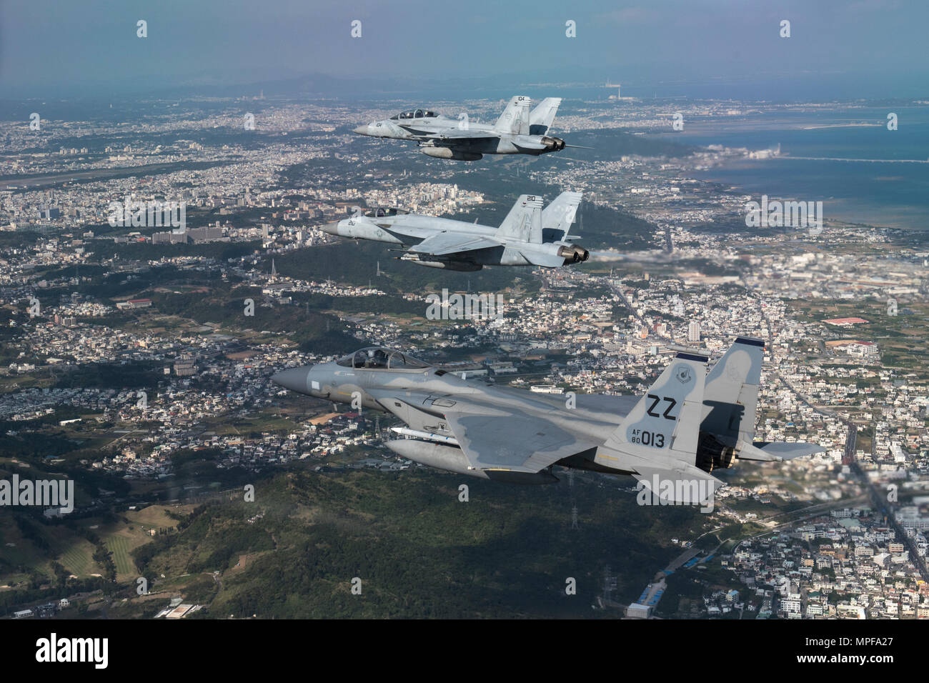 A U.S. Air Force 44th Fighter Squadron F-15 Eagle and U.S. Navy Strike ...