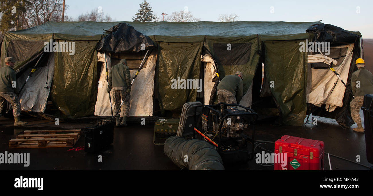 Airmen from the 1st Combat Communications Squadron wrap up a mock ...