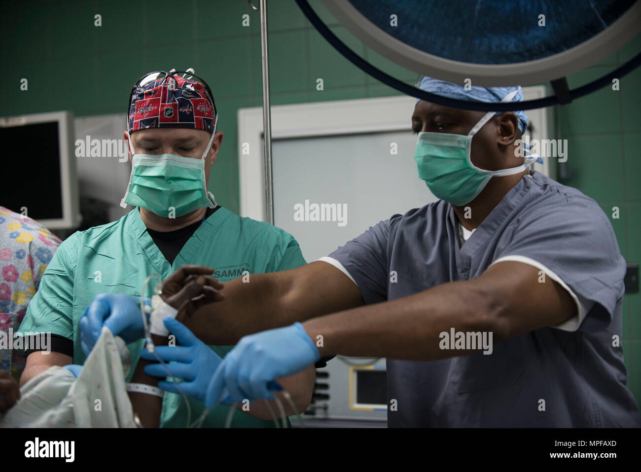 U.S. Army Maj. Keith Lathrop, a nurse anesthetist, and Sgt. 1st Class ...