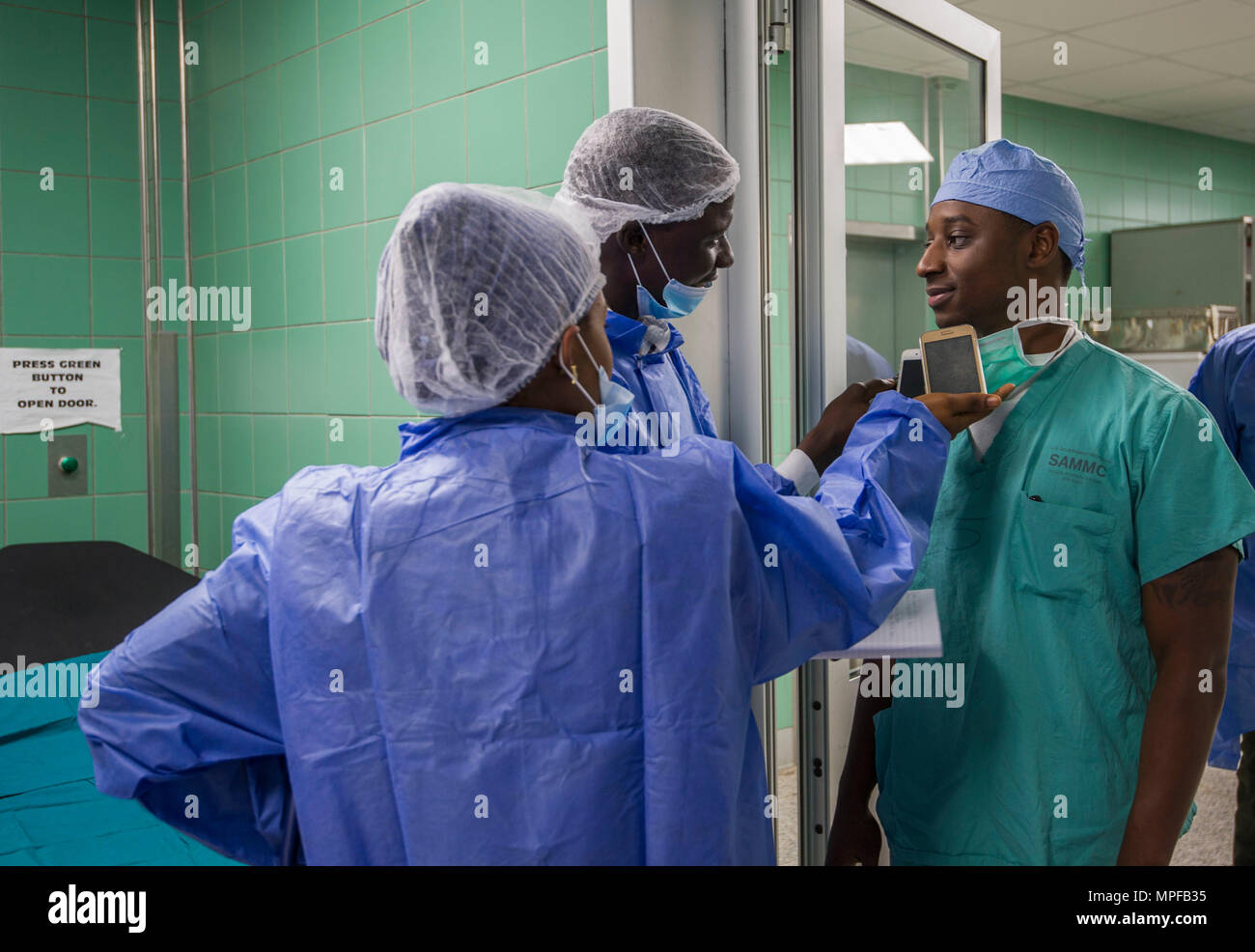 U.S. Army Sgt. Michael Harvey, an operating room specialist assigned to ...
