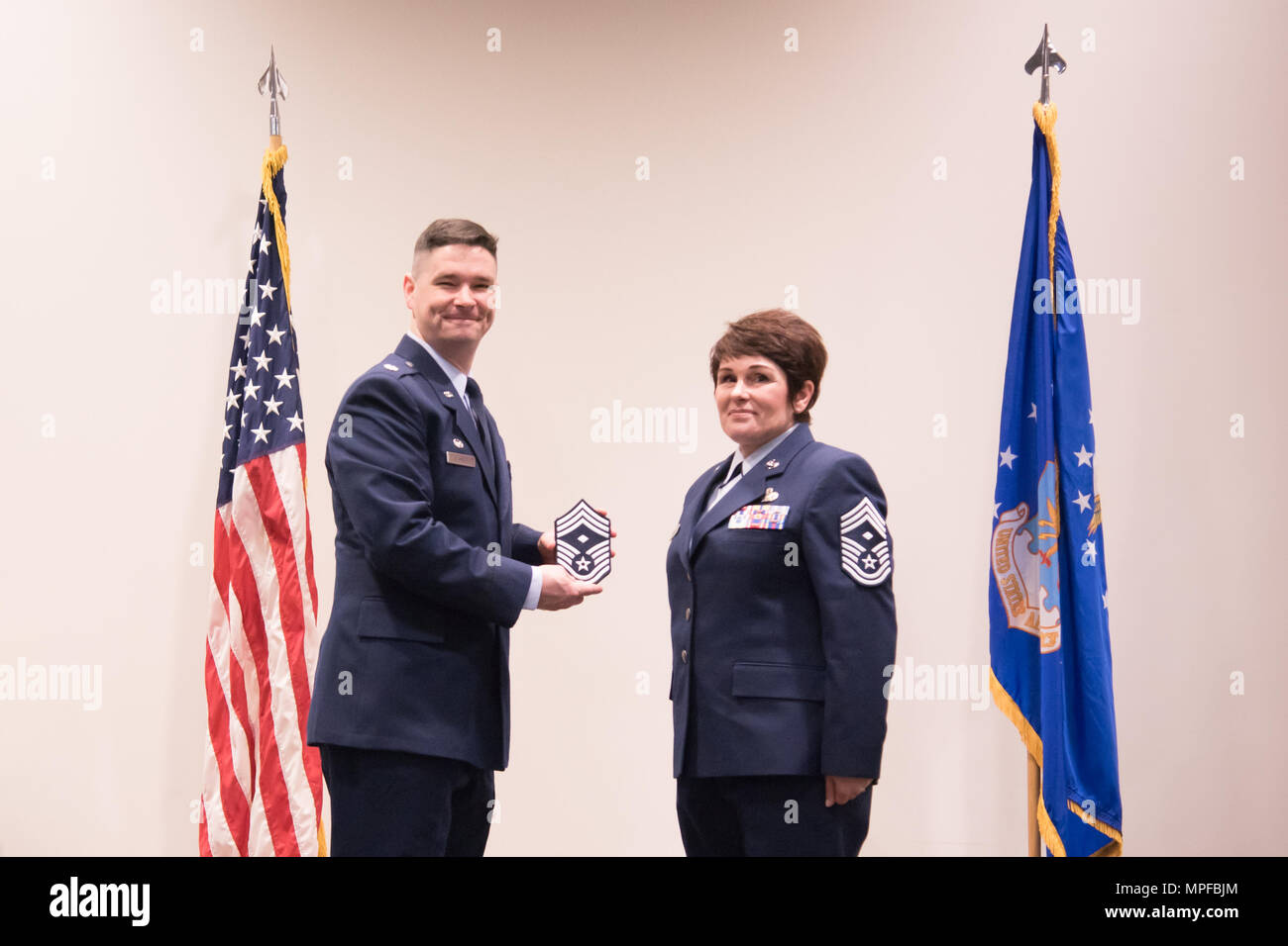 Lt. Col. Quinten Sasnett, 403rd Maintenance Squadron commander holds up ...