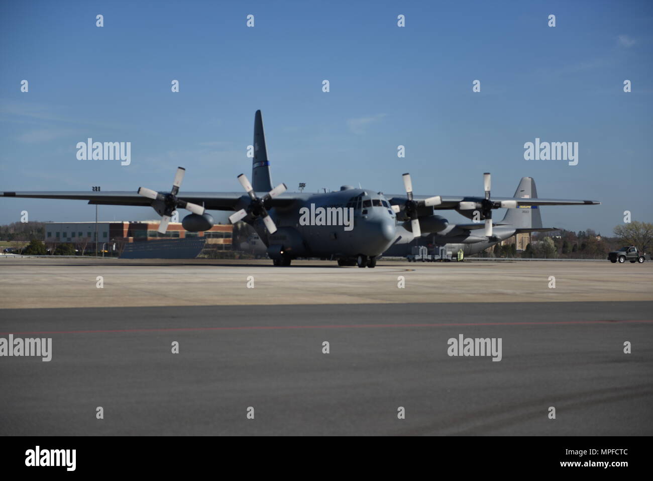 A C-130 carrying airmen to support Operation Freedom's Sentinel taxies ...