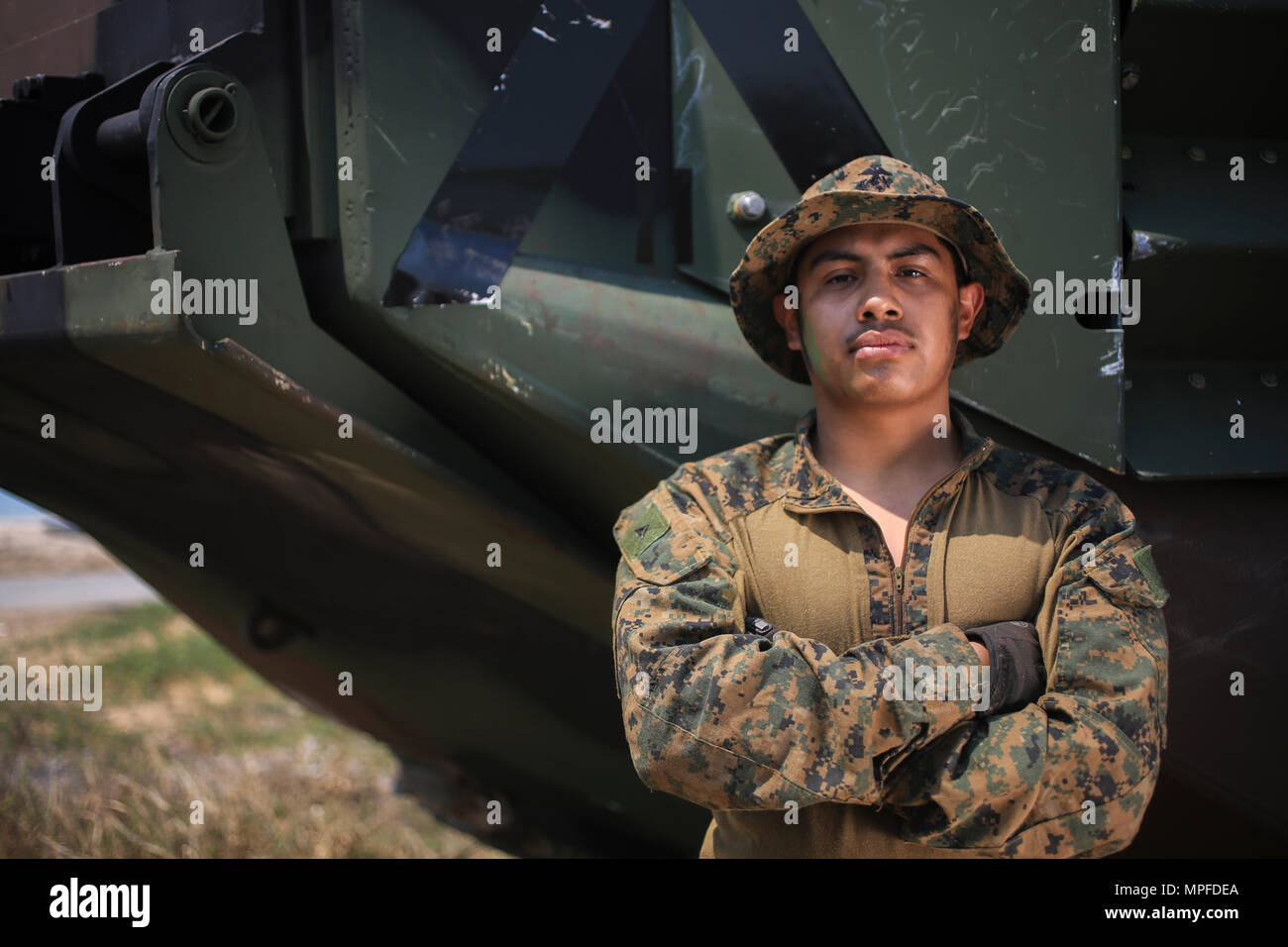 U.S. Marine Corps Lance Cpl. Moises Escobar, an assault amphibious ...