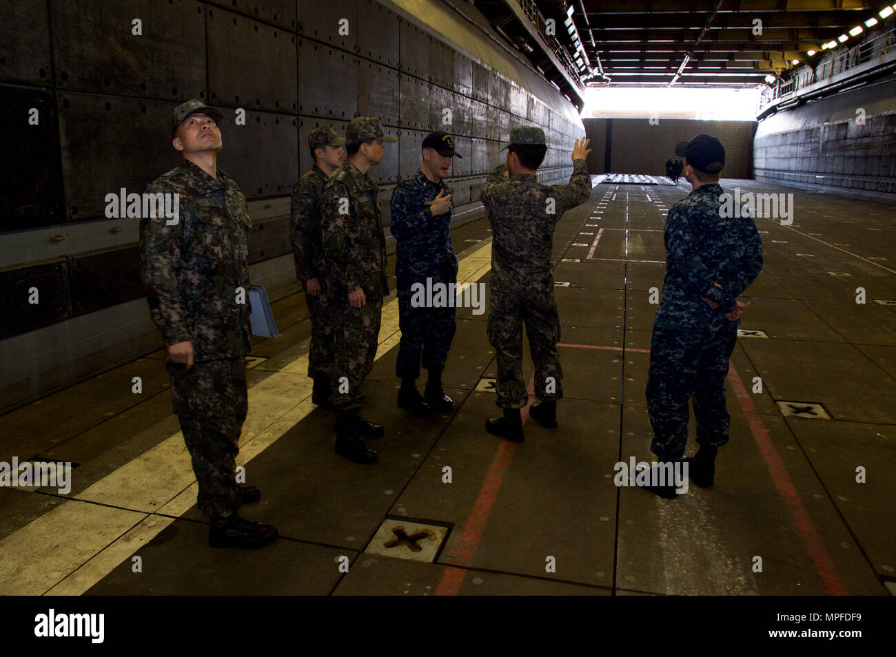 170223-N-RU971-064 SASEBO, Japan (Feb. 23, 2017) Lt. j.g. Ray Norris ...