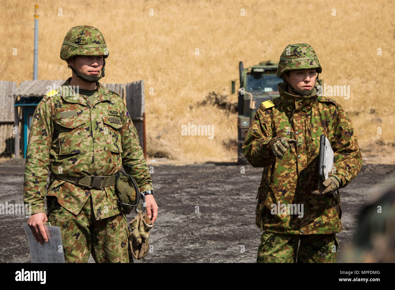 Service members with the Japan Ground Self-Defense Force give a speech ...