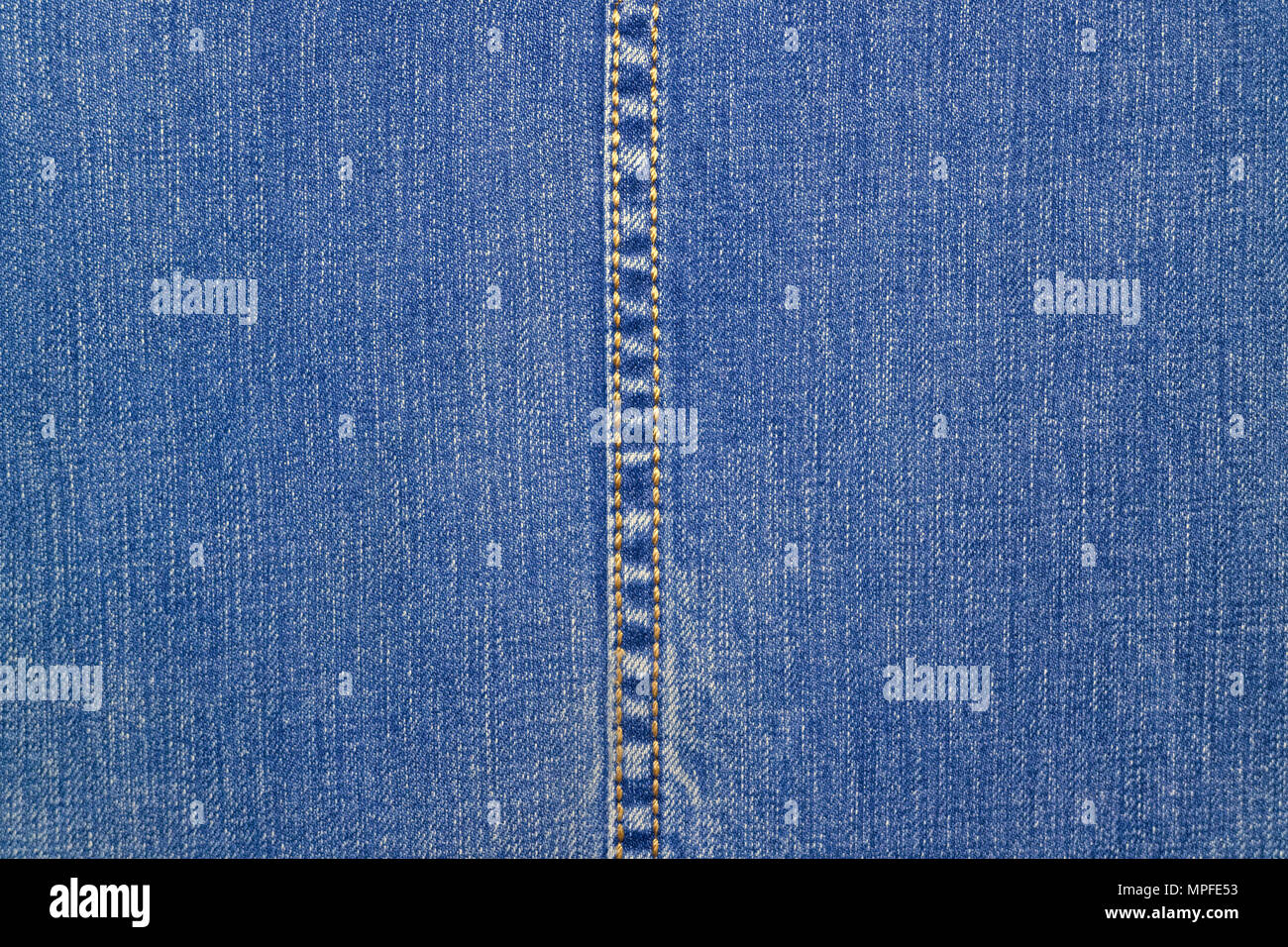 Blue denim with a vertical seam in the middle. Fabric blue background ...