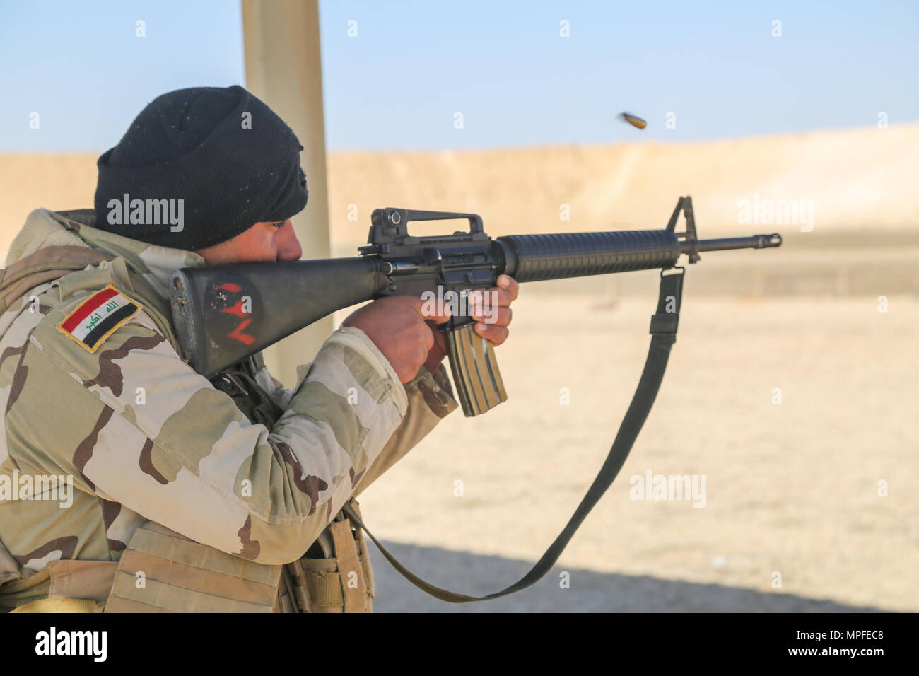 An Iraqi security forces soldier from 7th Iraqi Army Division fires his ...