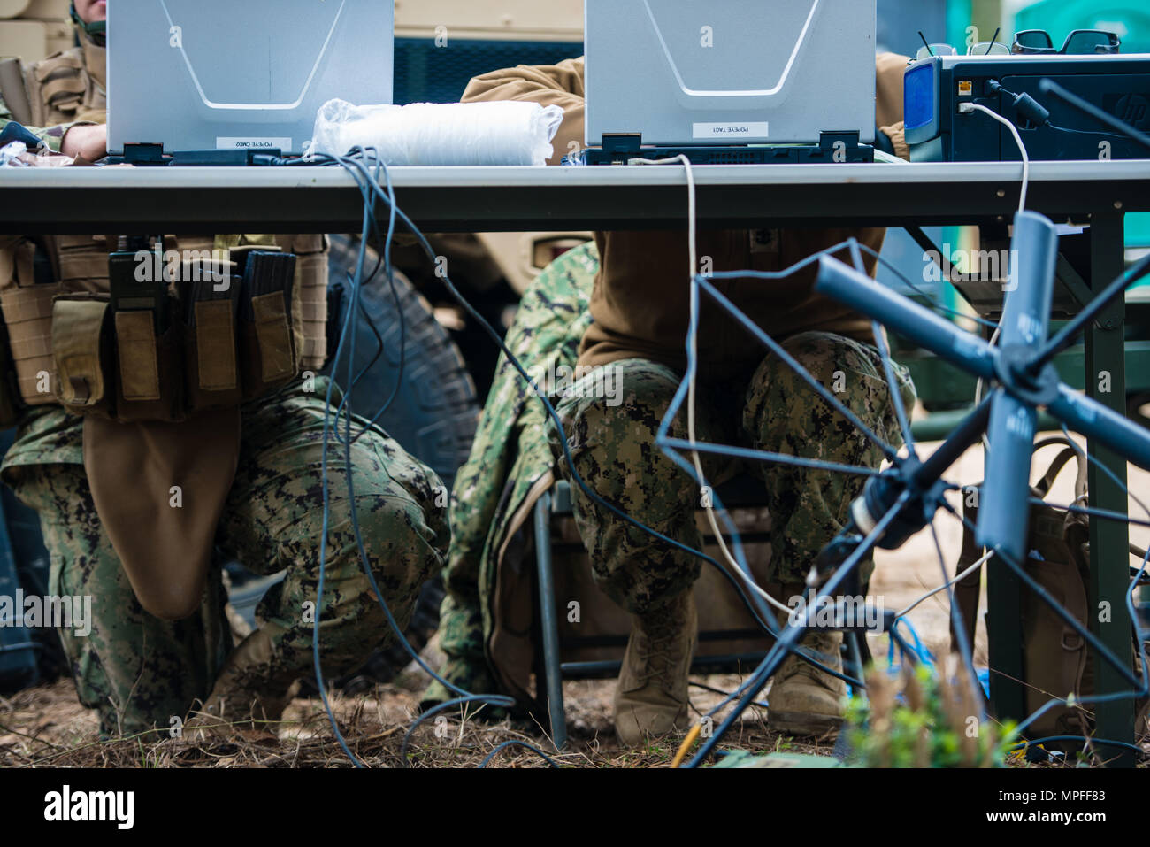 Seabees from Naval Mobile Construction Battalion (NCB) 133 work on a ...
