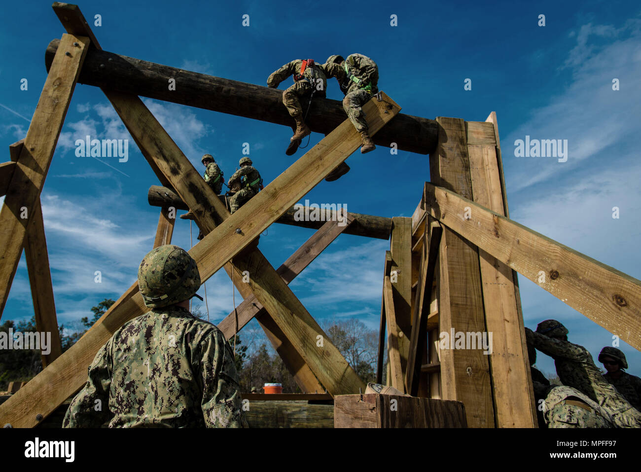 Sailors from Naval Mobile Construction Battalion (NCB) 133 work ...