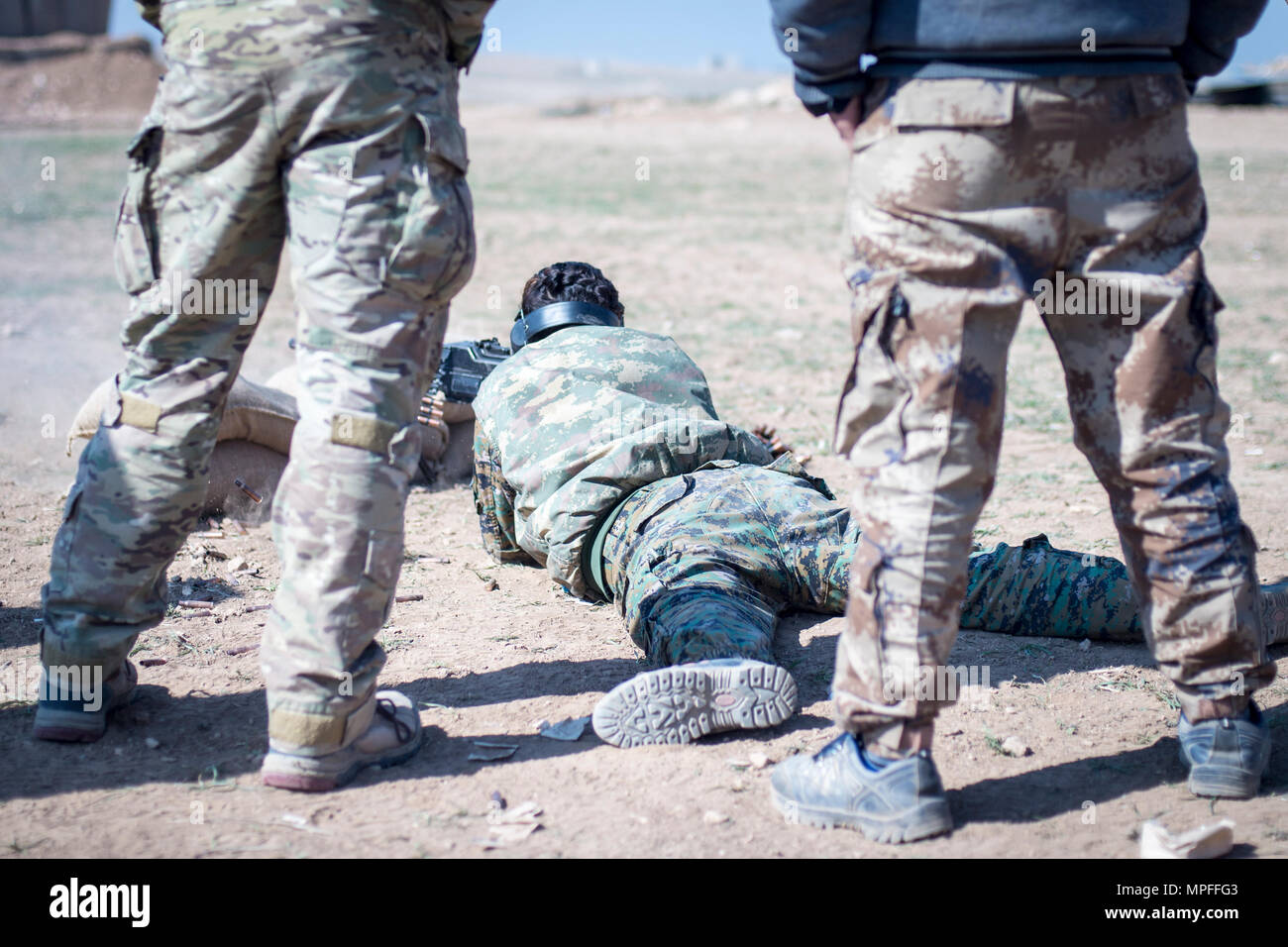 A U.S. Special Forces operator advises a local female Manbij Military ...