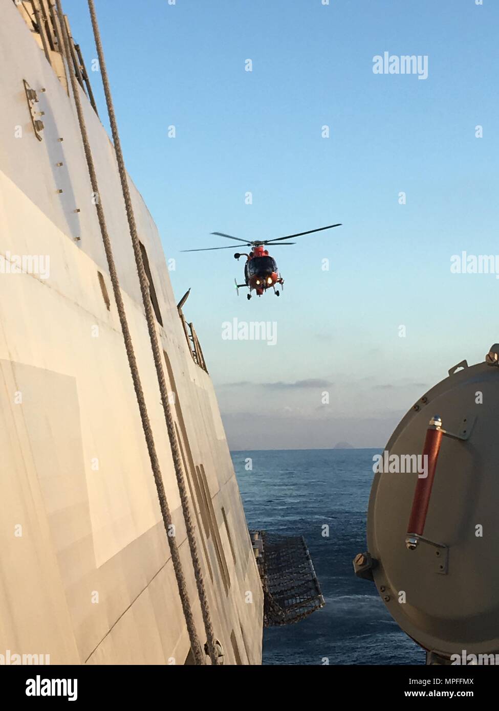 170216-N-ZZ999-011 PACIFIC OCEAN A U.S. Coast Guard helicopter prepares ...