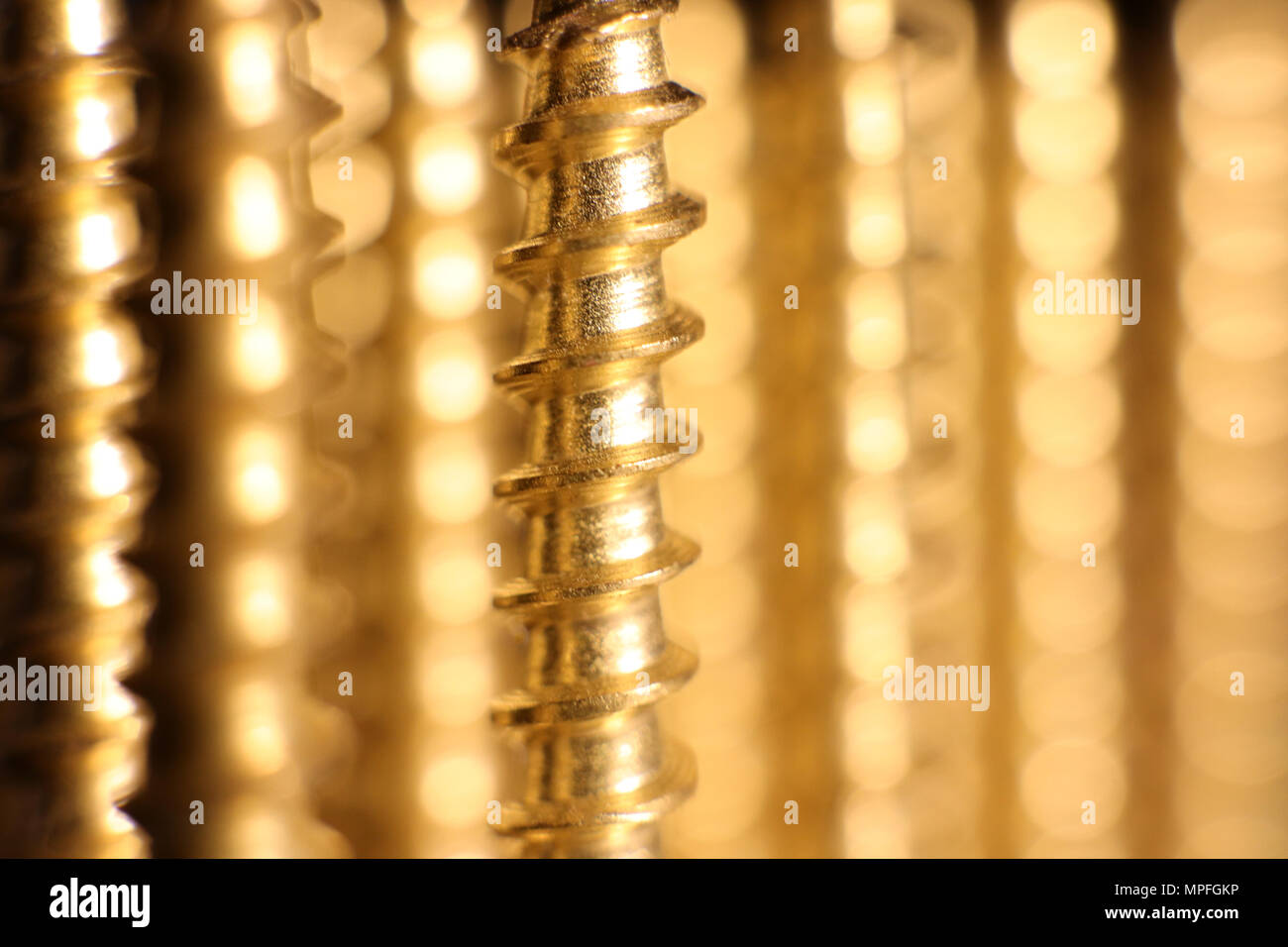 Golden screws hi-res stock photography and images - Alamy