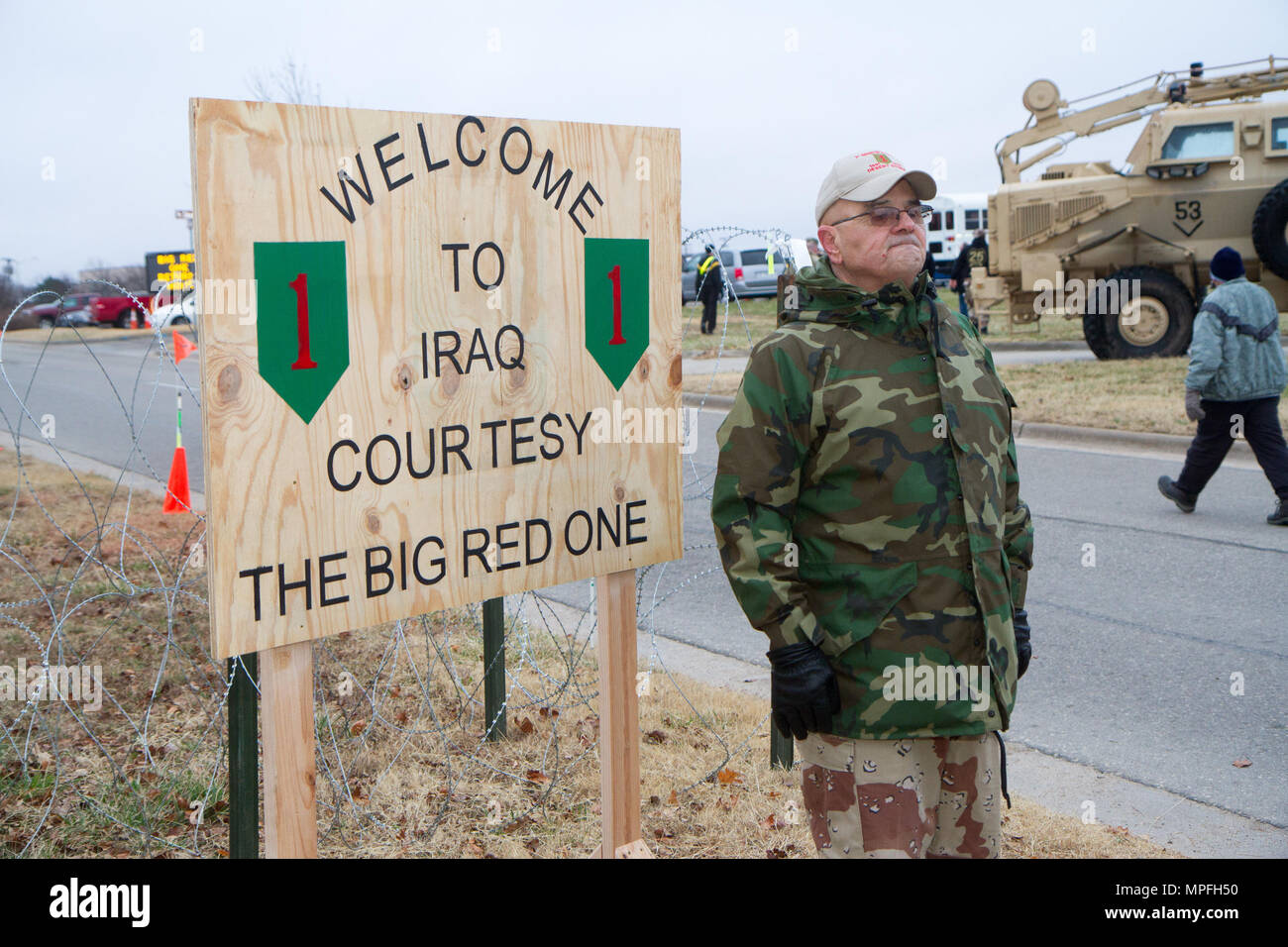 Retired Col. Greg Fontenot stands near a replica sign during the 26th ...