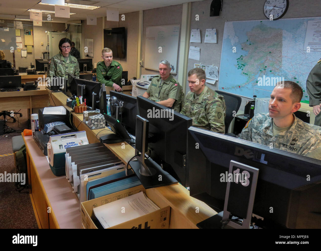Exercise participants work together in the Joint Operations Center ...