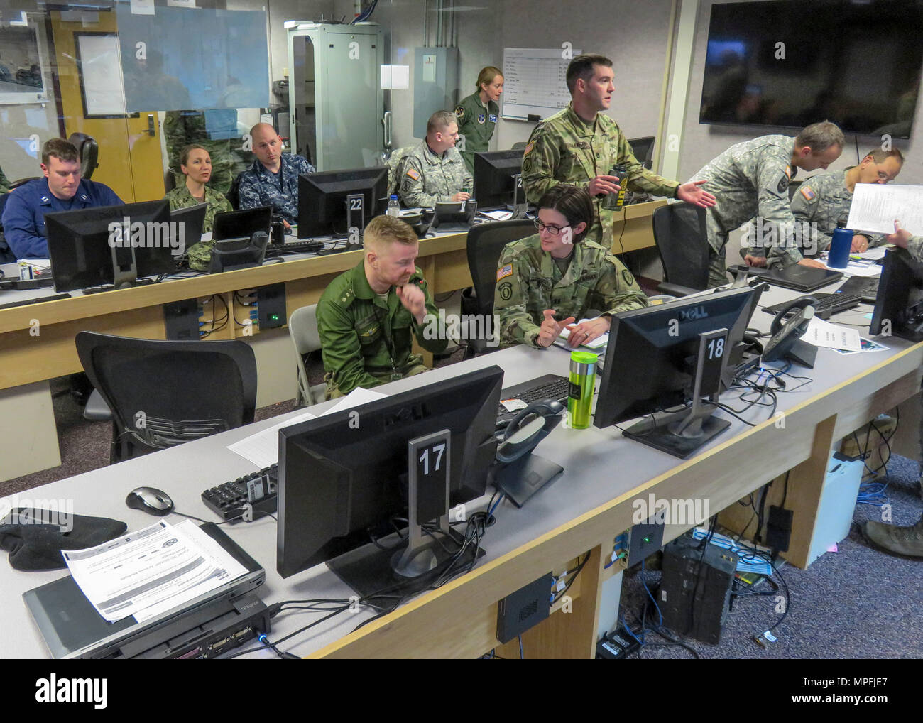 Exercise participants work together in the Joint Operations Center ...