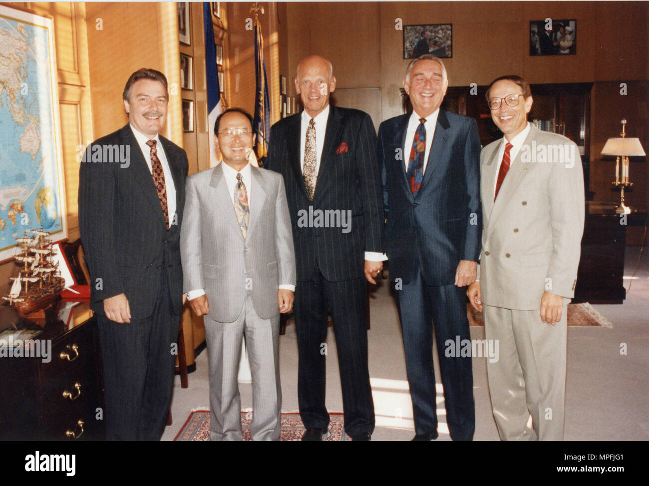 FIVE MEN ARE STANDING IN THE OFFICE TAKING A PICTURE Stock Photo - Alamy